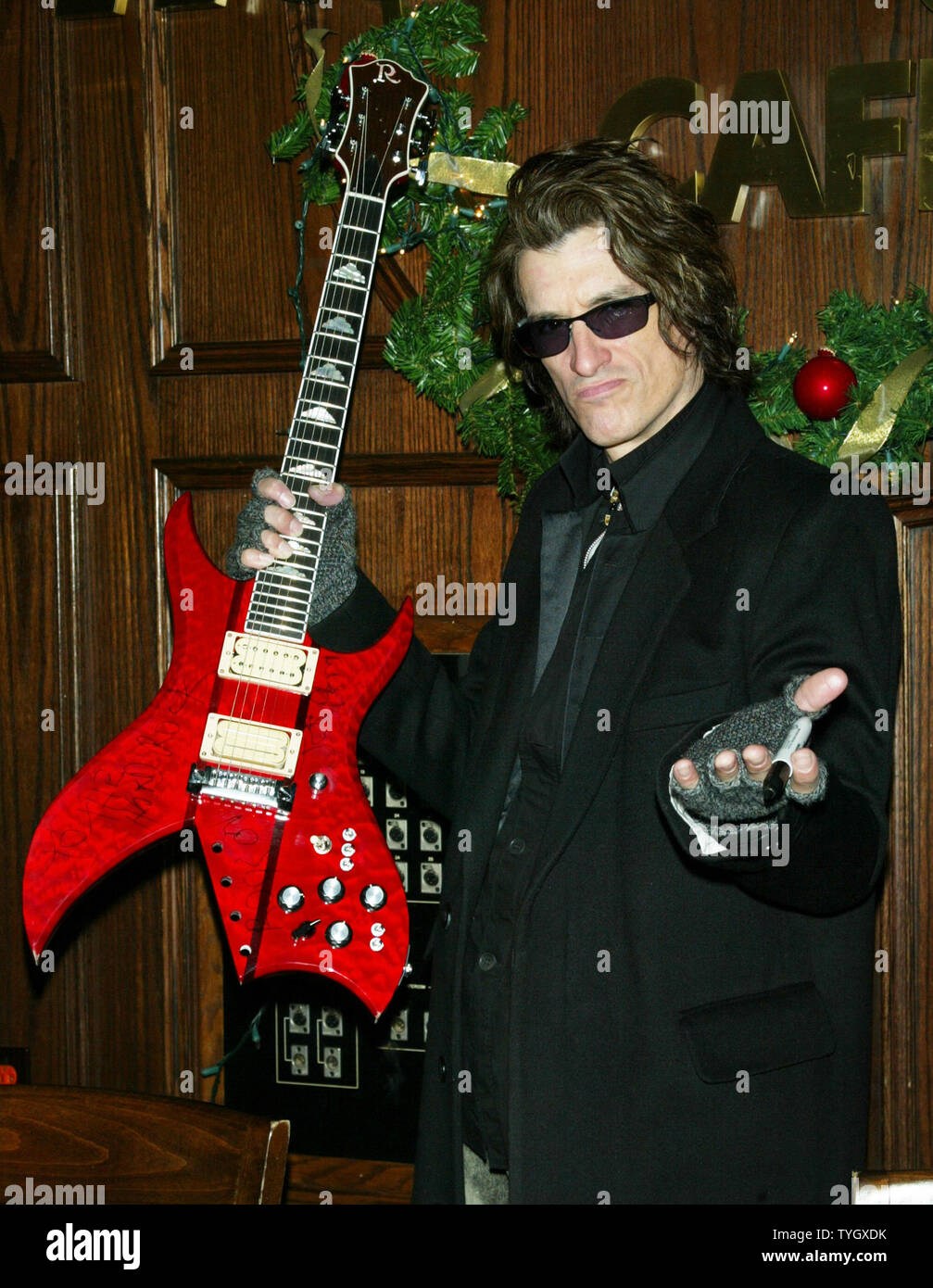 Joe Perry (Aerosmith lead guitarist) signs bottles of his "Rock Your ...