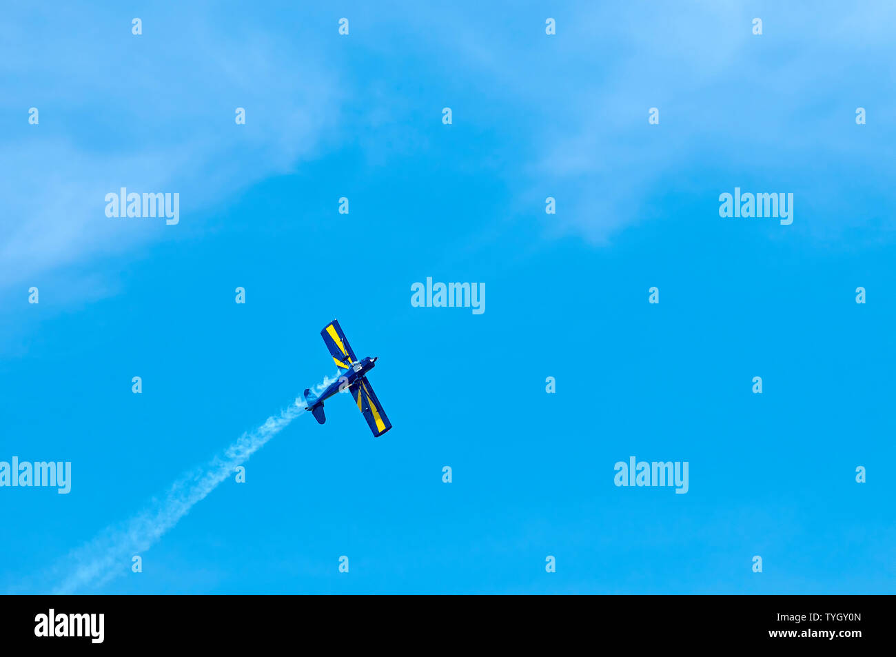 An aerobatic aircraft emitting a smoke trail during an airshow in Pitt ...