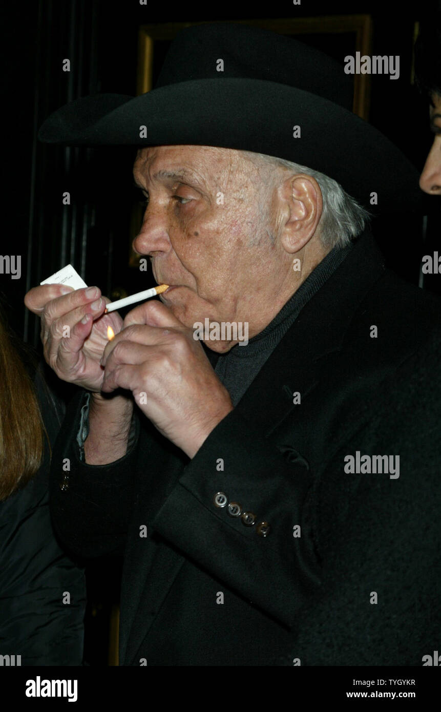 Jake LaMotta lights up a cigarette INSIDE the Ziegfeld Theaster as he ...