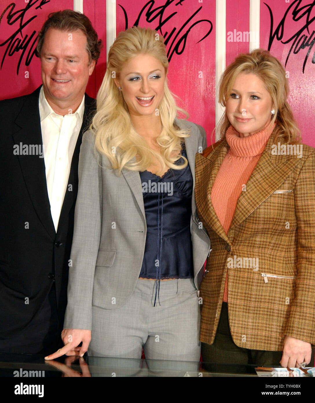 Paris Hilton (center) poses with her parents Rick and Cathy at the 2/10 ...