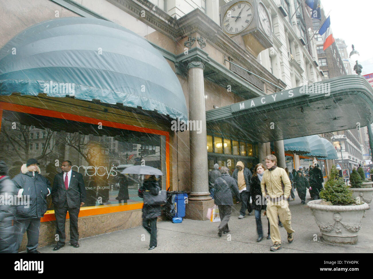 People walk past the Macy's store in Herald Square as Federated ...
