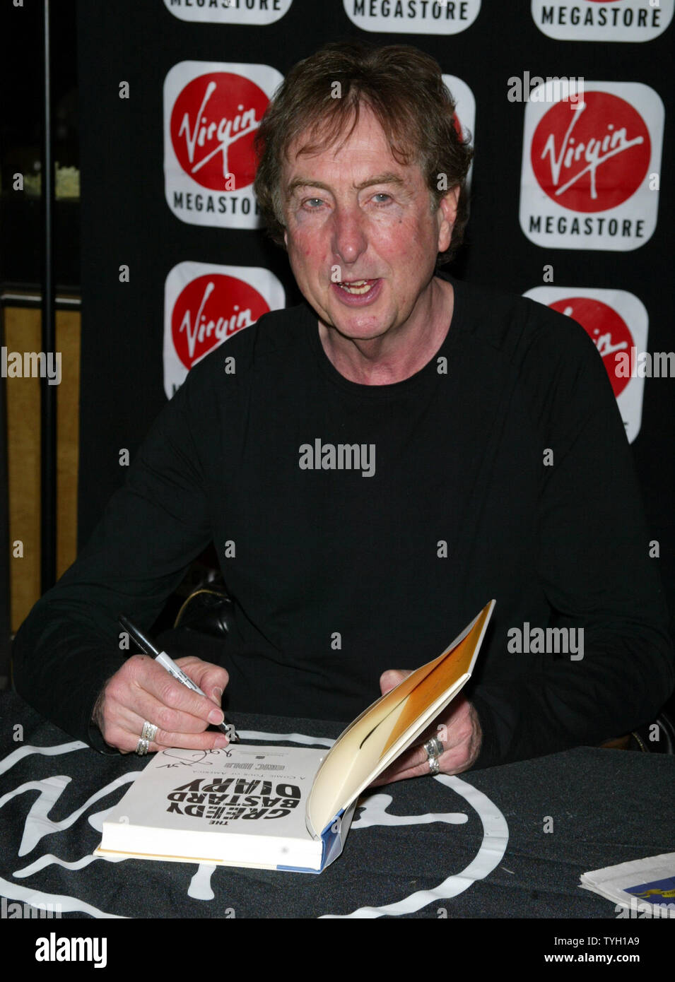 Eric Idle signs copies of his new book "The Greedy Bastard Diary" at ...