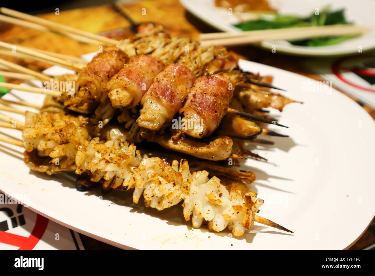 grilled squid , grilled pork and barbecued bacon, bacon wrapped enoki ...