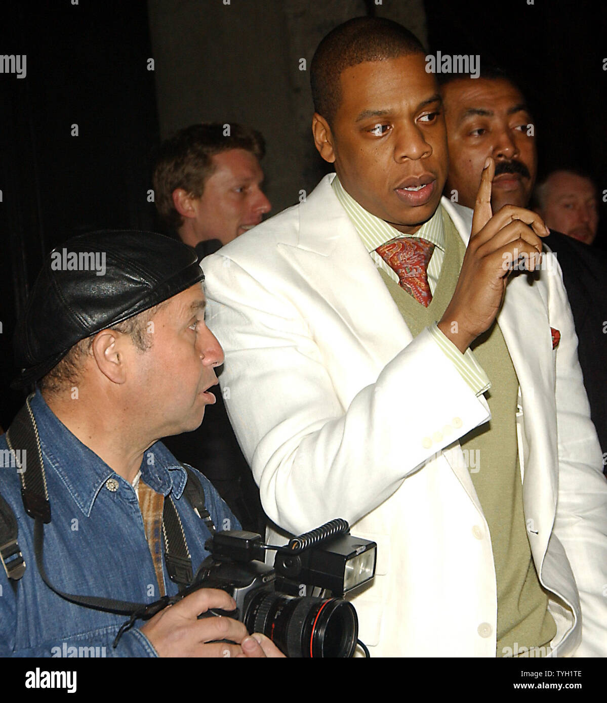 Rapper Jay Z makes his way past photographers while attending the April ...