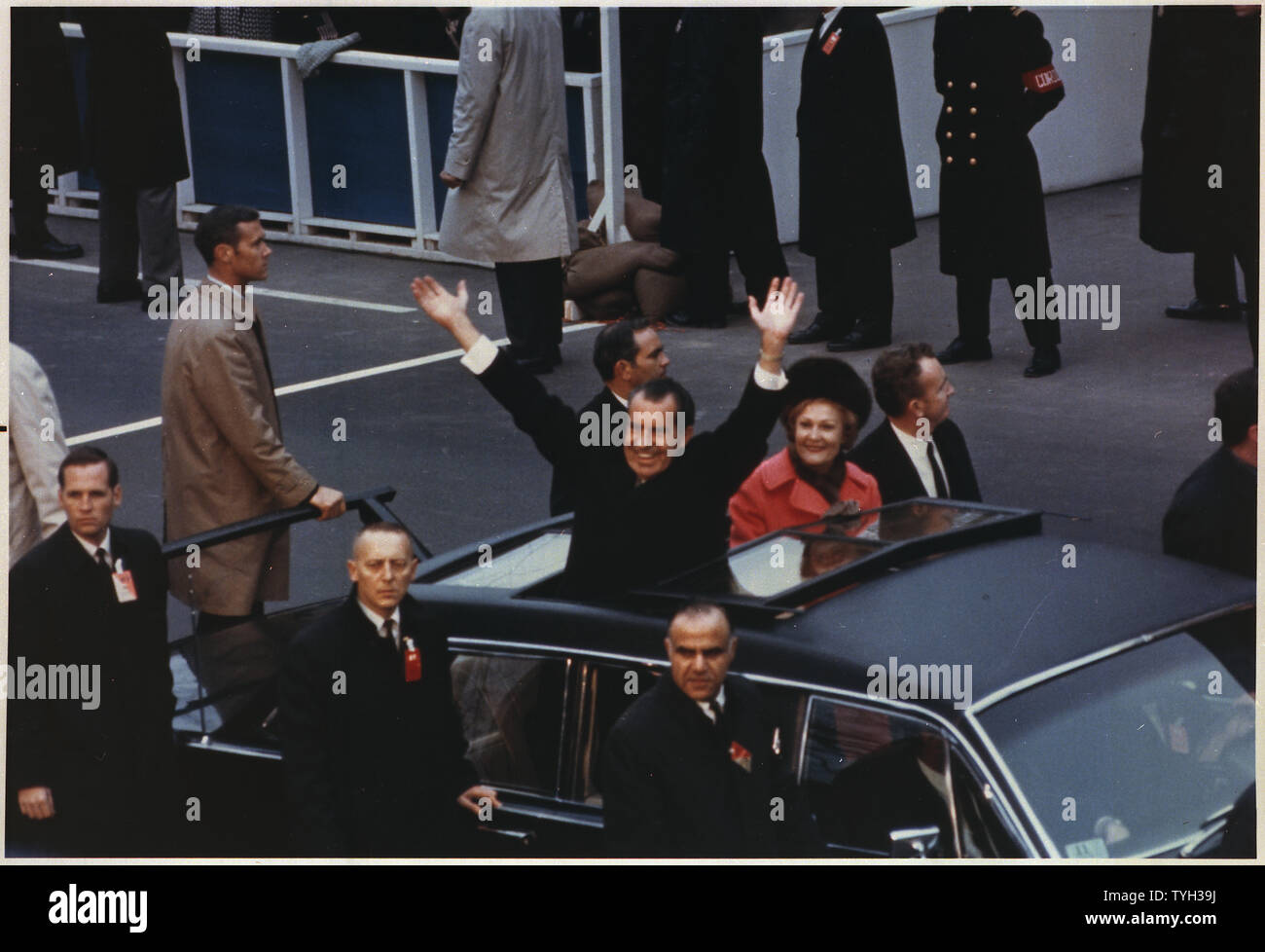 President and Mrs. Nixon waving to the crowd from the Presidential ...
