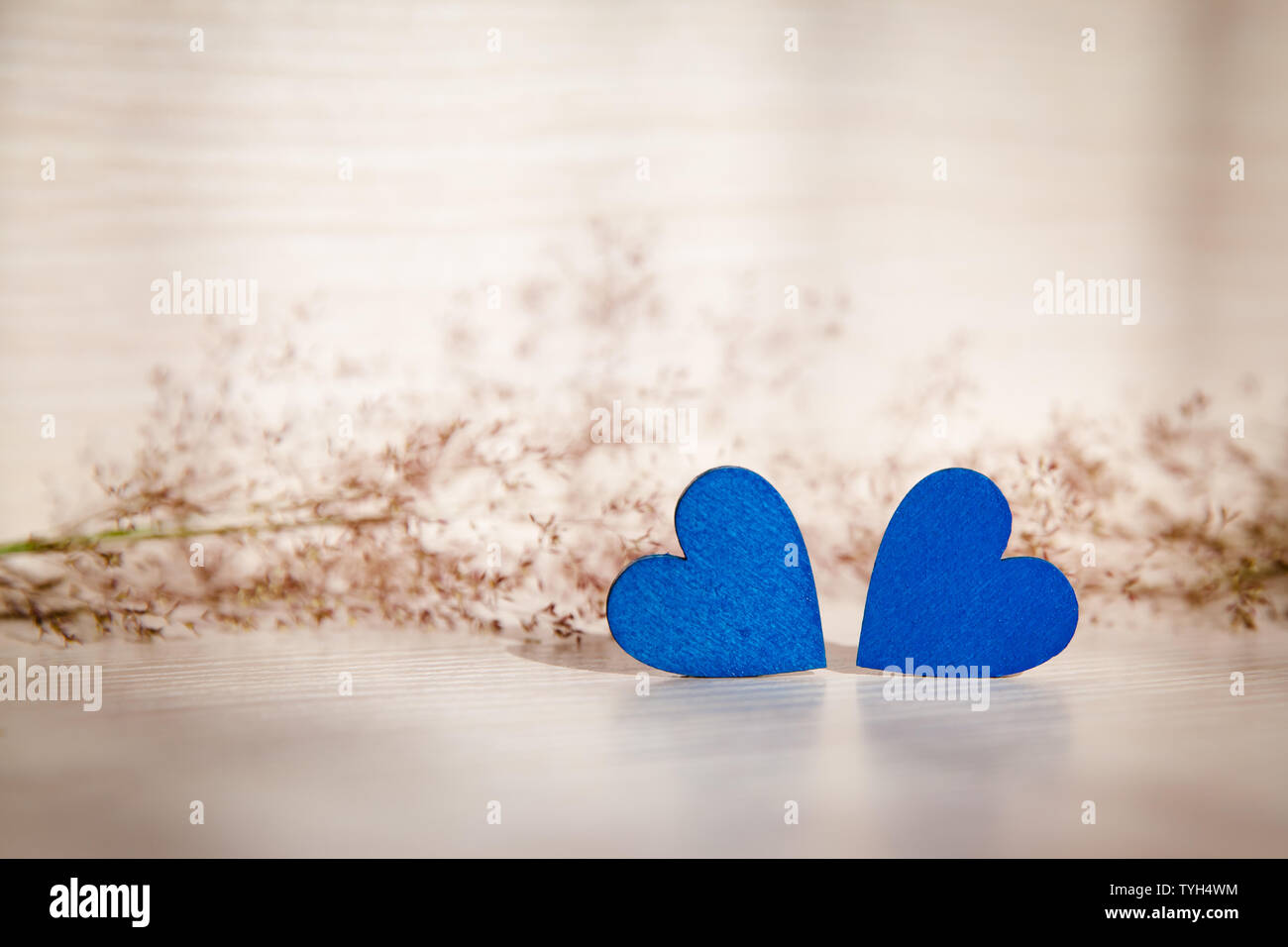 Two hearts, background for greetings on Valentine's Day. Wooden hearts ...