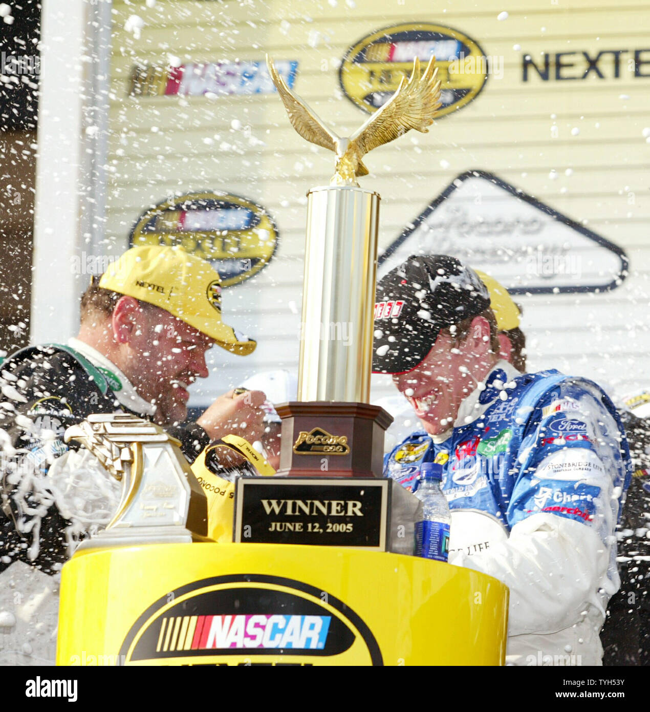 Carl Edwards celebrates with champagne after winning at NASCAR's Pocono ...