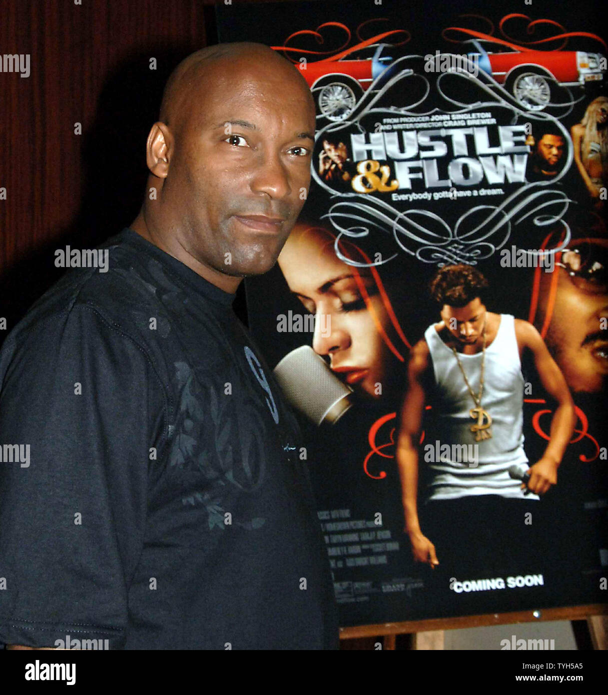 Director John Singleton poses at the June 27, 2005 New York premiere ...