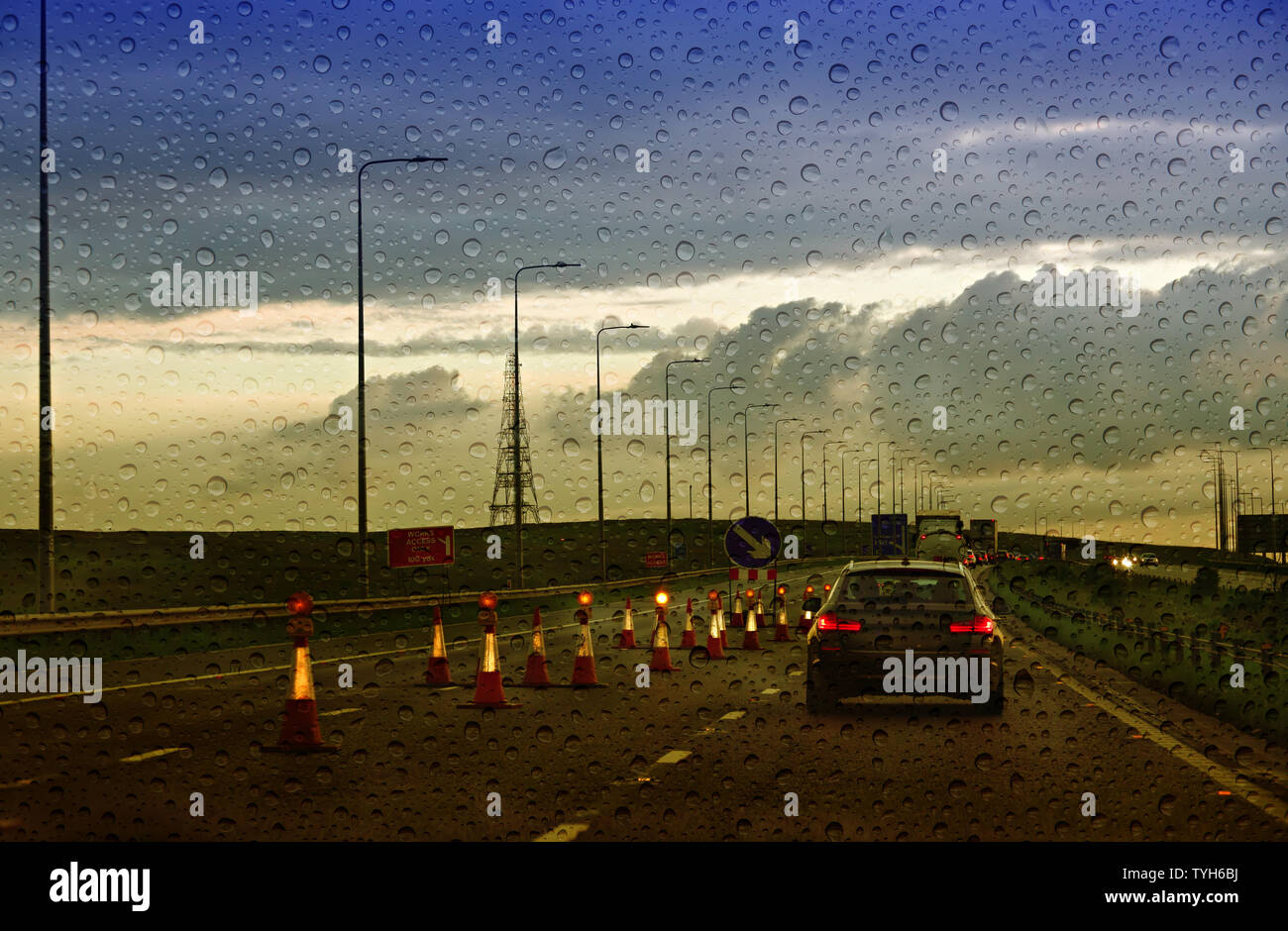 M62 motorway traffic at dusk with rain drops on the windscreen Stock ...