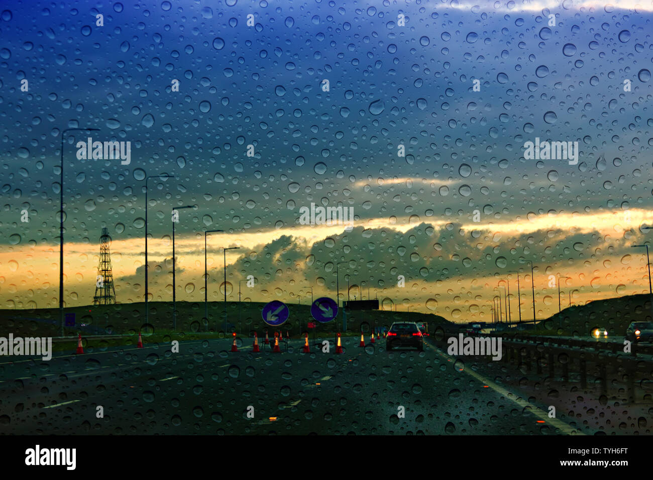 M62 motorway traffic at dusk with rain drops on the windscreen Stock ...