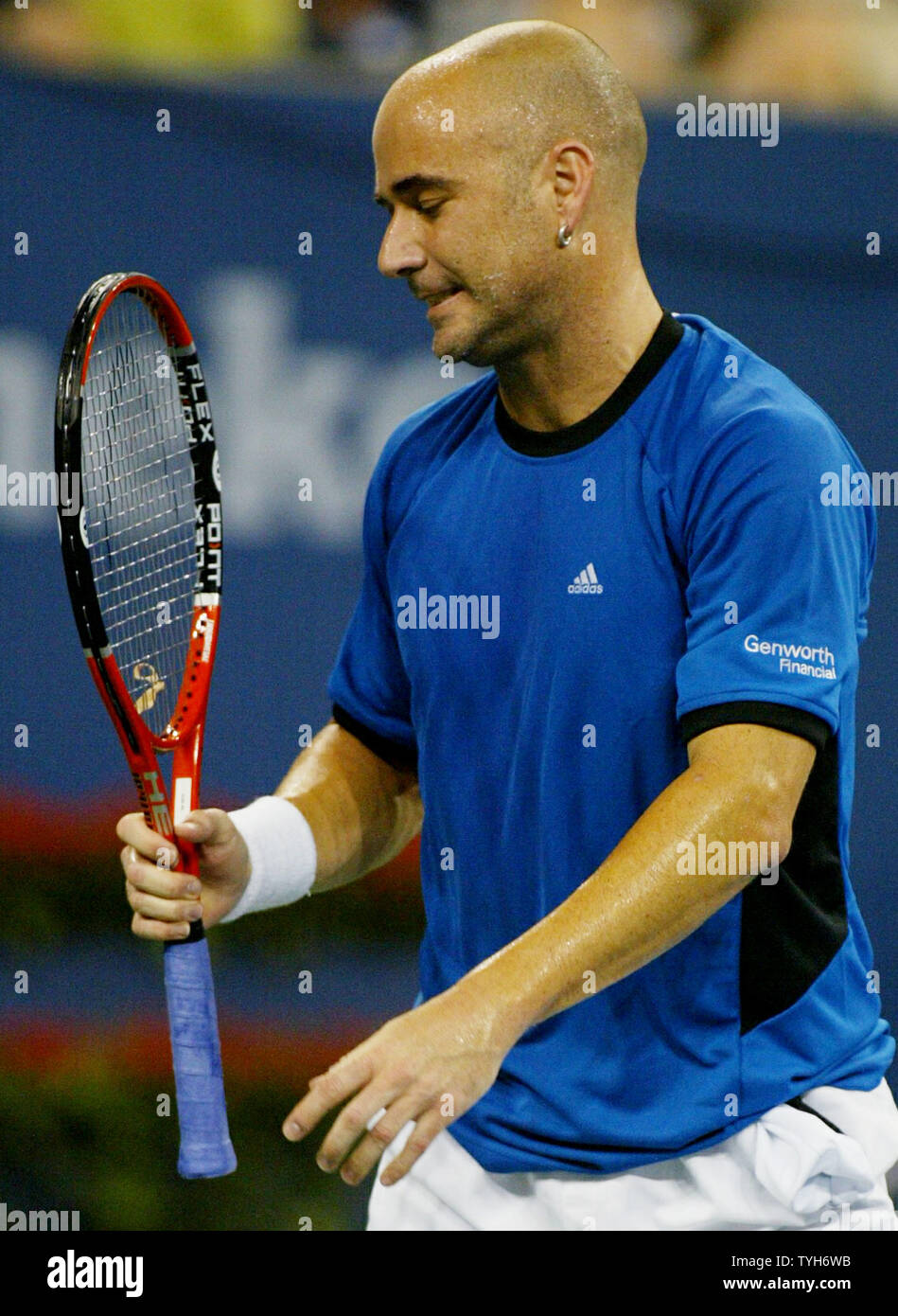 Andre Agassi ( USA), who is seeded at seven, reacts as he looses a point to Razvan Sabau of ...