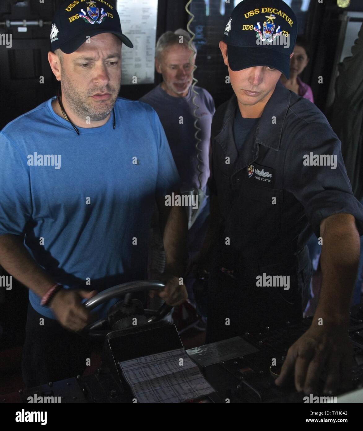 PACIFIC OCEAN (Nov. 9, 2016). Seaman Chris Foster explains helmsman ...