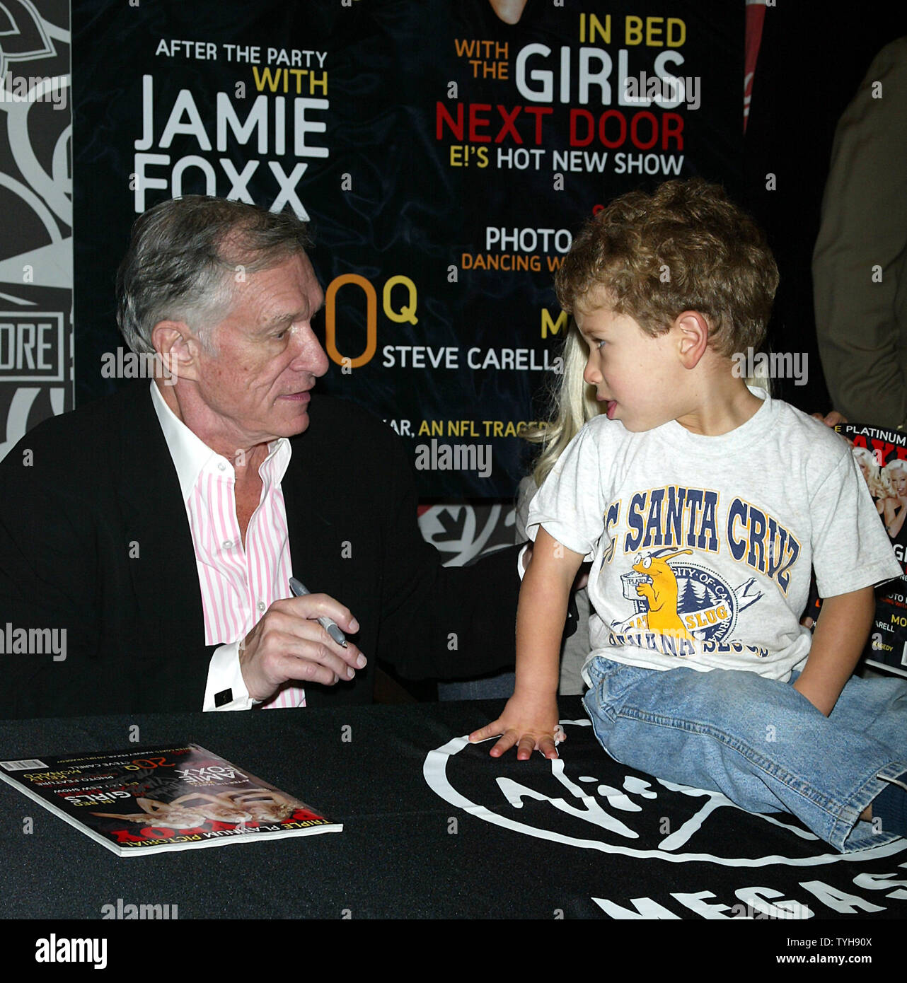 Hugh Hefner meets young fan Jeremy Zorek as he autographs the November ...