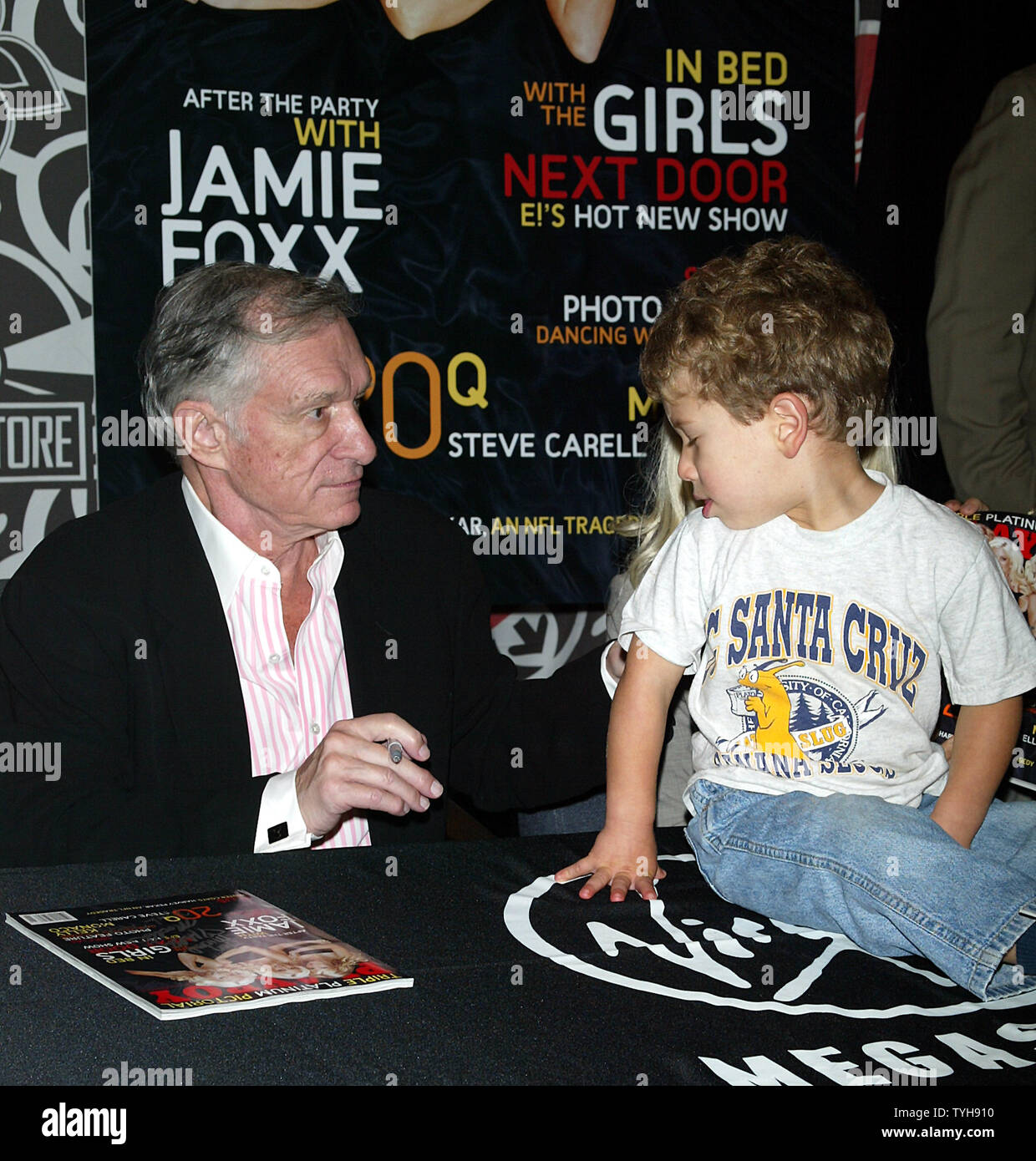 Hugh Hefner meets young fan Jeremy Zorek as he autographs the November ...