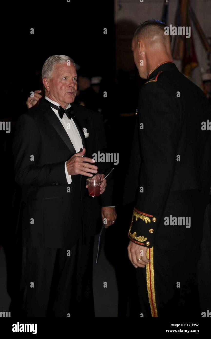 Col. Robert Cooper (right) greets retired Gen. James F. Amos (left) at ...