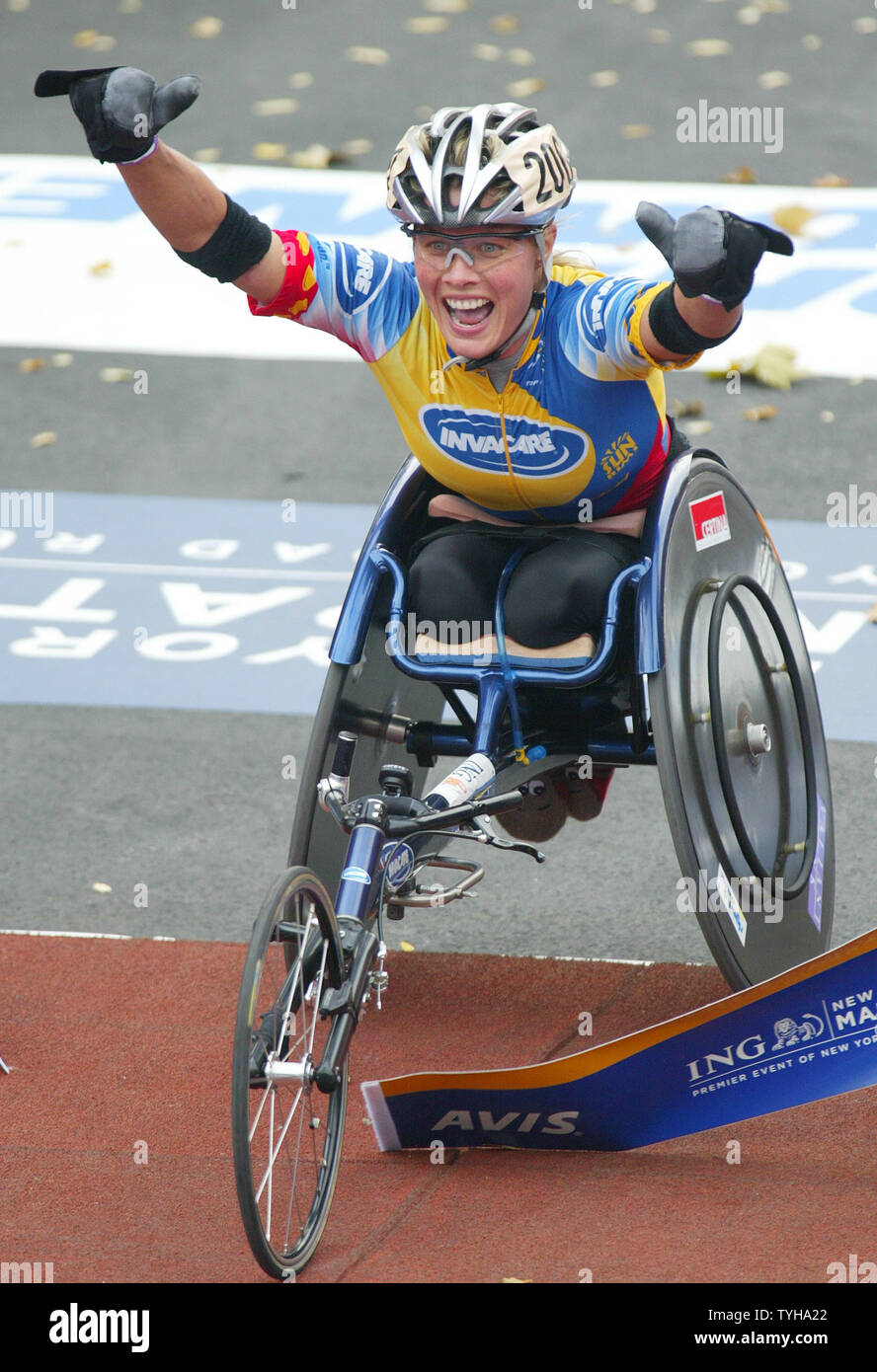 Edith Hunkeler of Switzerland reacts as she crosses the finish line to ...