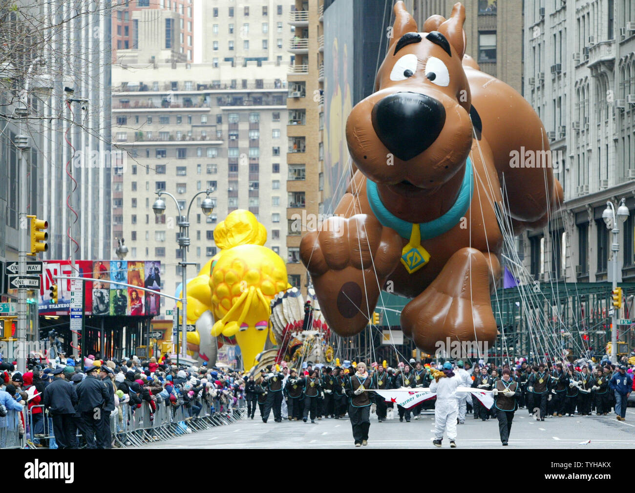 The Scooby Doo giant helium balloon, followed by Big Bird, is guided ...