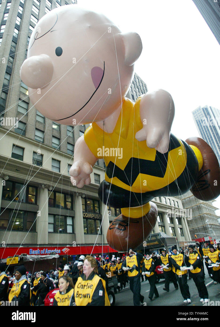 The Charlie Brown giant helium balloon is guided down Broadway during ...