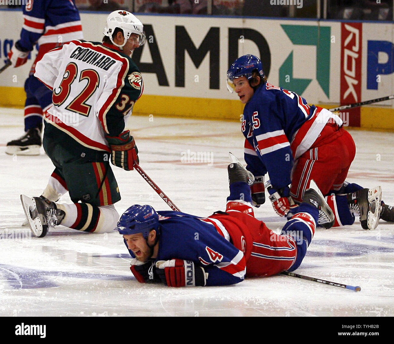 New York Rangers (25) Petr Prucha and (14) Jason Ward hit the ground ...