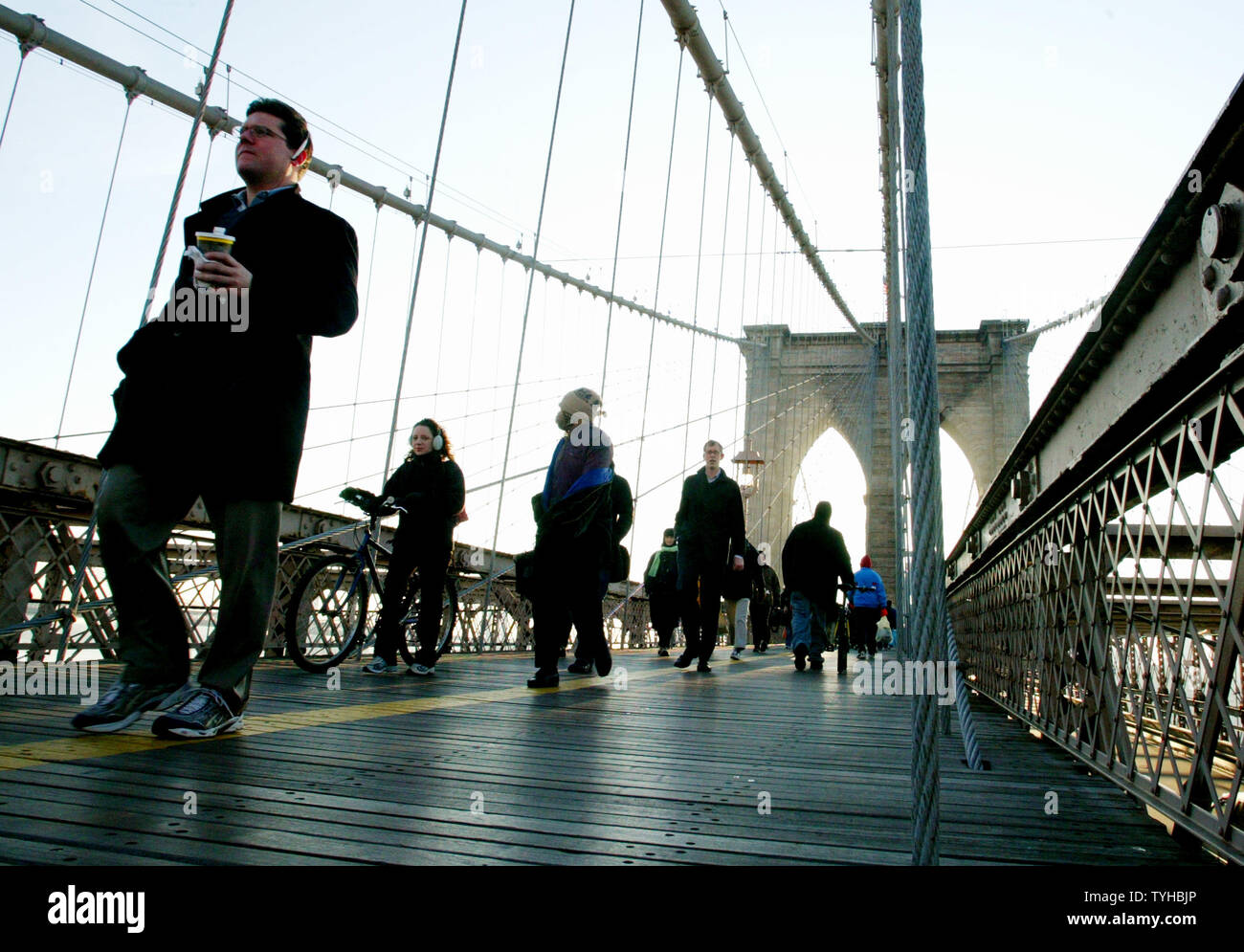 Commuters cross the Brooklyn Bridge to get to work in Manhattan on the ...
