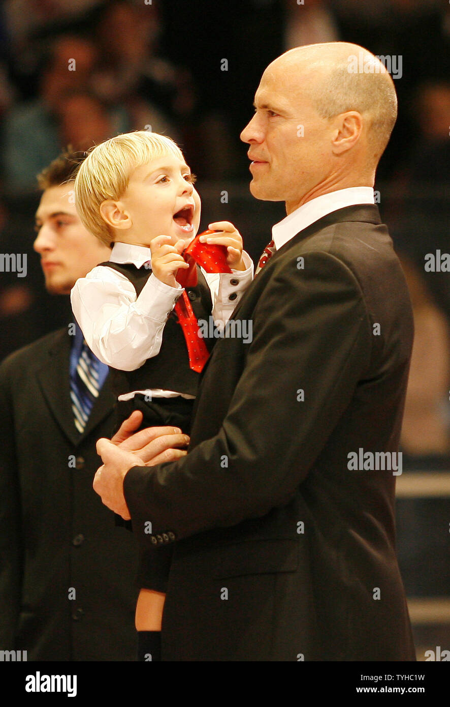 New York Rangers longtime captain Mark Messier holds his son Douglas ...