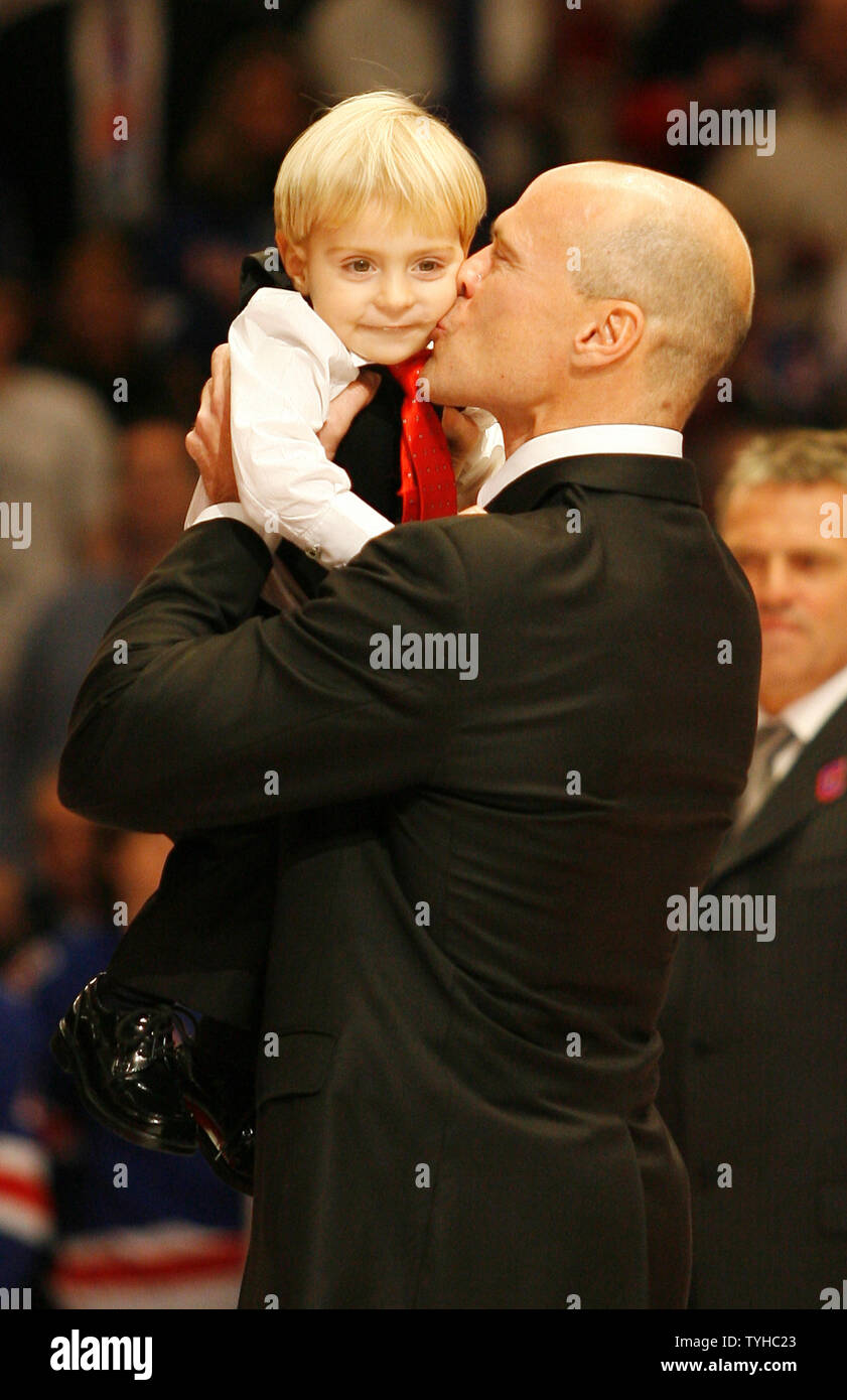 New York Rangers longtime captain Mark Messier kisses his son Douglas ...