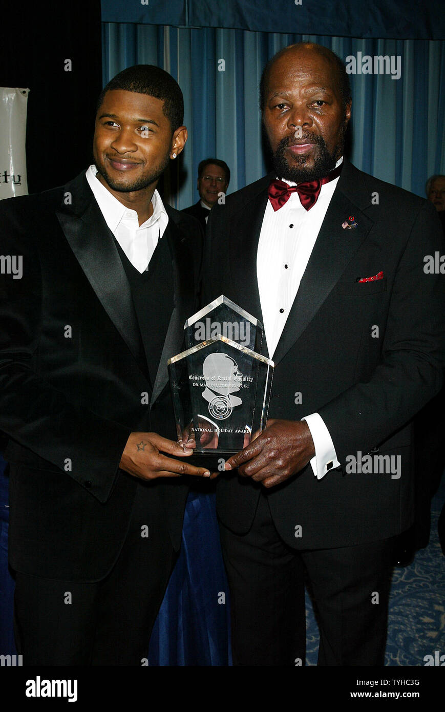 Roy Innis (right) and Usher at the Congress of Racial Equality's (C.O.R ...