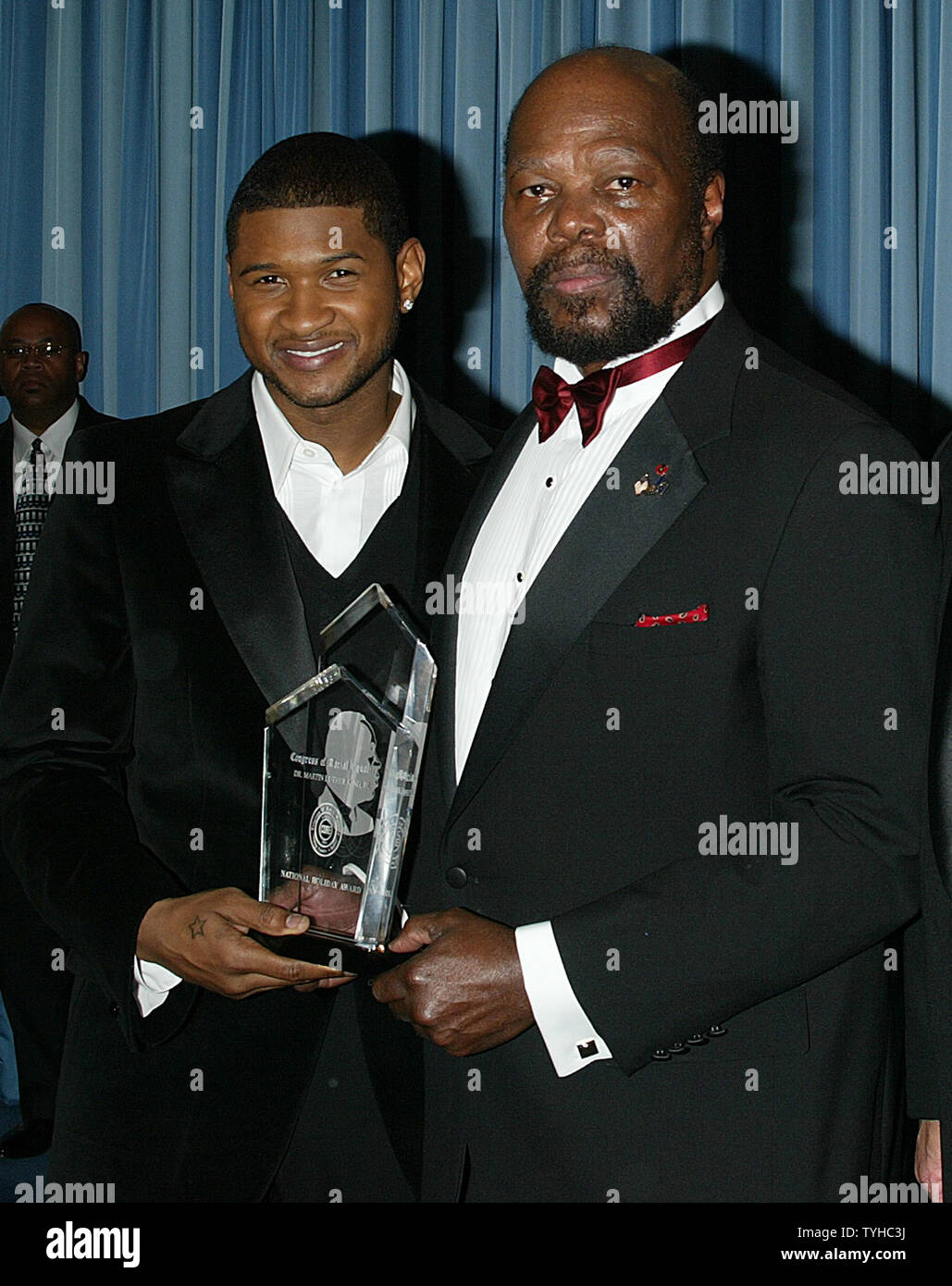 Usher (left) and Roy Innis at the Congress of Racial Equality's (C.O.R ...