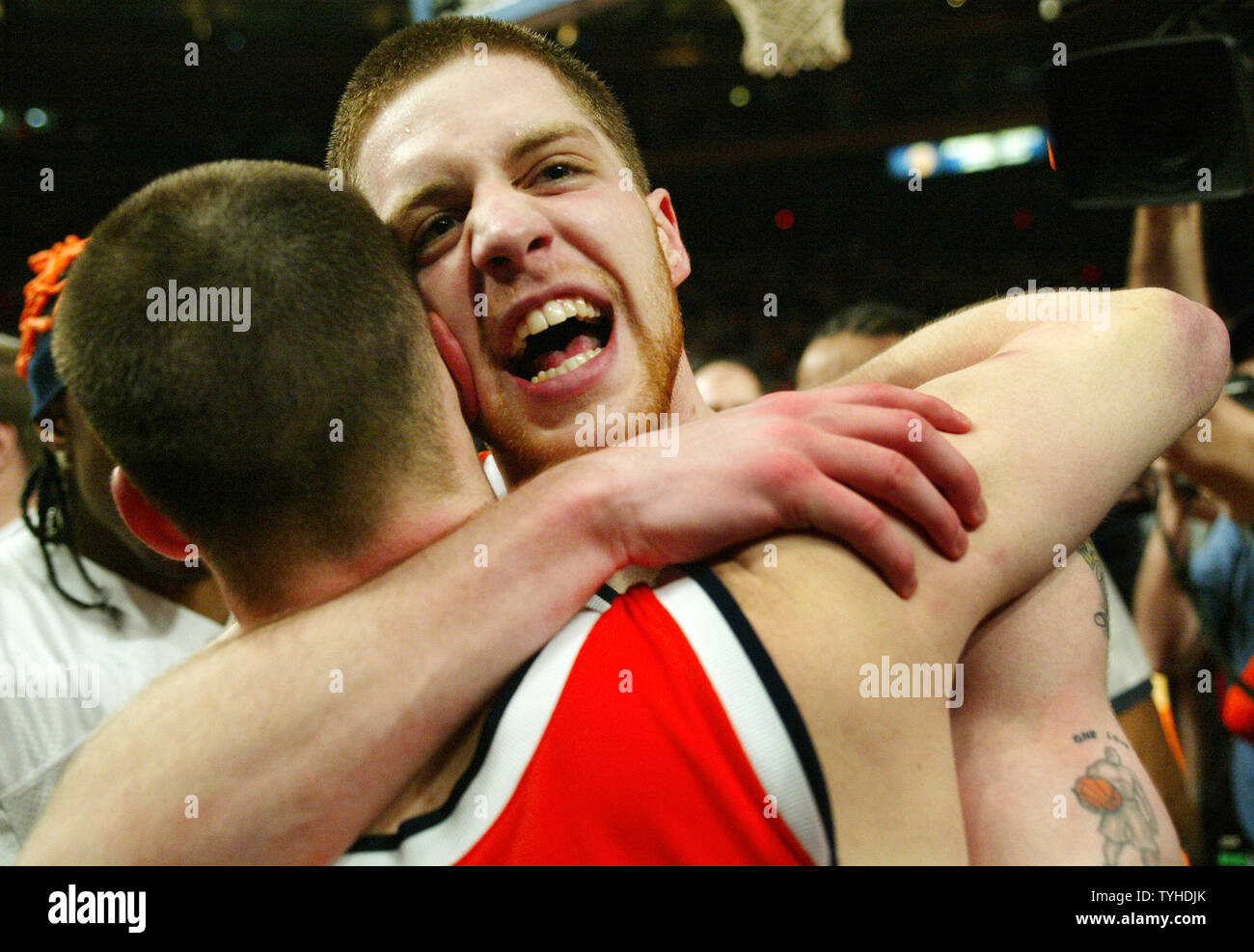 Syracuse's Gerry McNamara, left, gets a hug from teamate Eric Devendorf ...