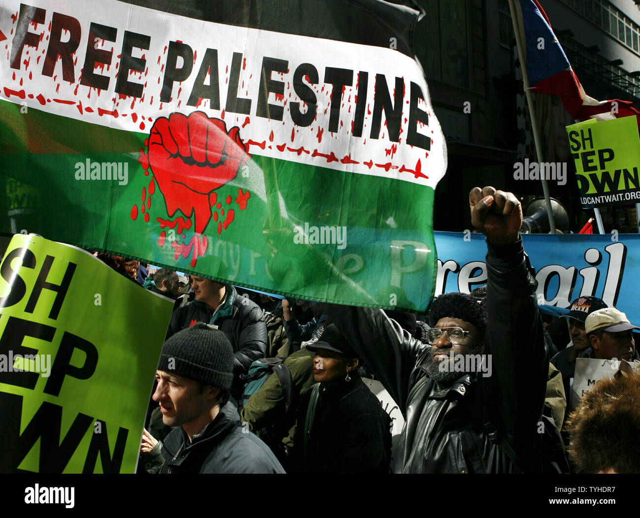 Protesters hold up signs on the third anniversary of the United States ...