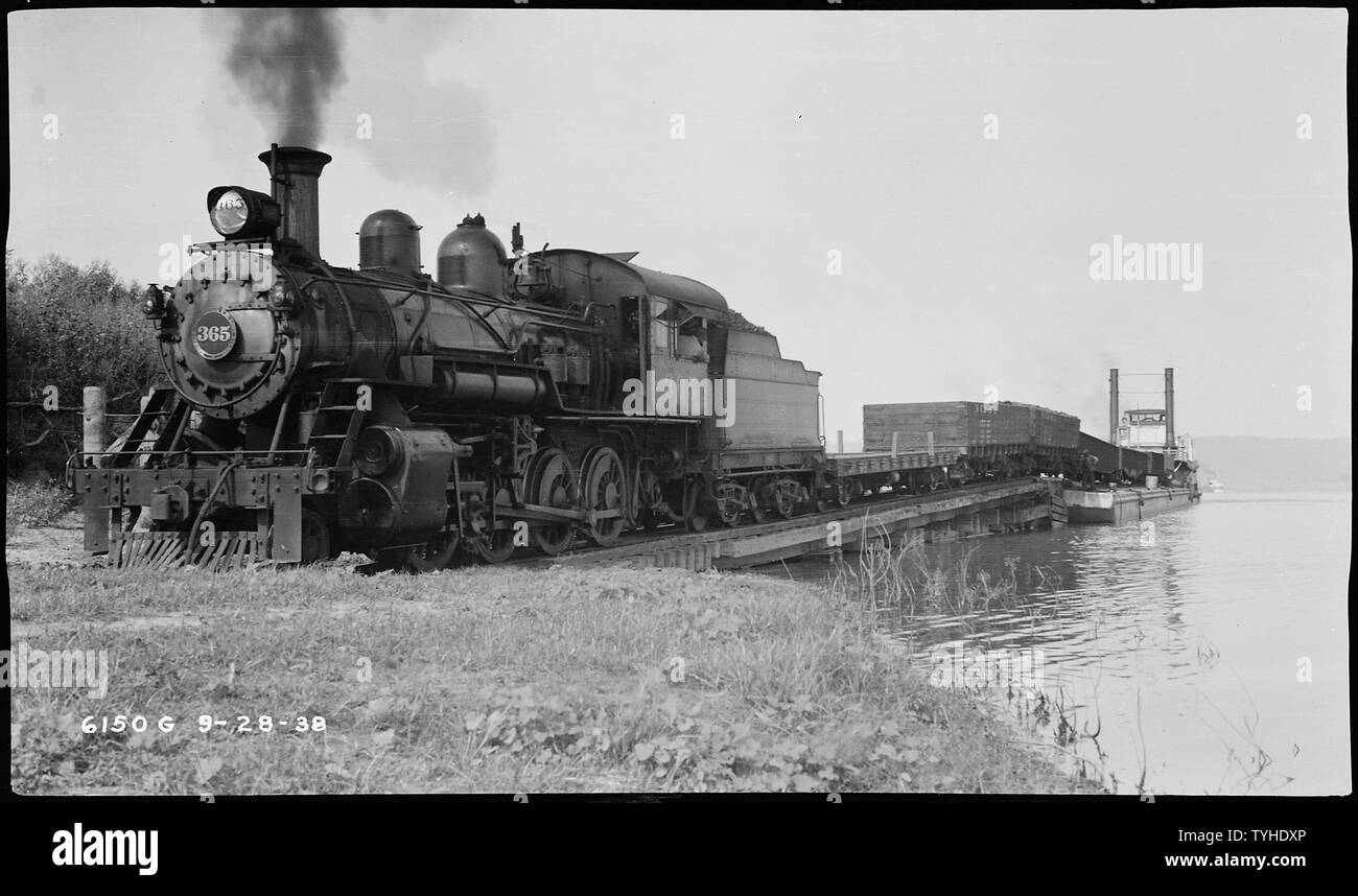 Railroad re-location with train engine Stock Photo - Alamy