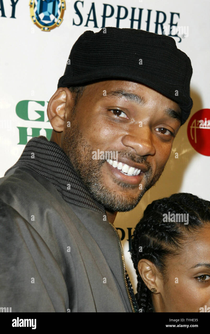 Will Smith smiles while walking down the red carpet at the premiere of ...