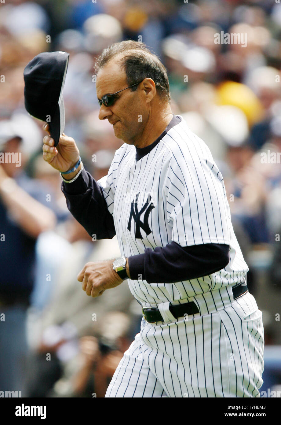 New York Yankees manager Joe Torre tips his hat after being introduced ...