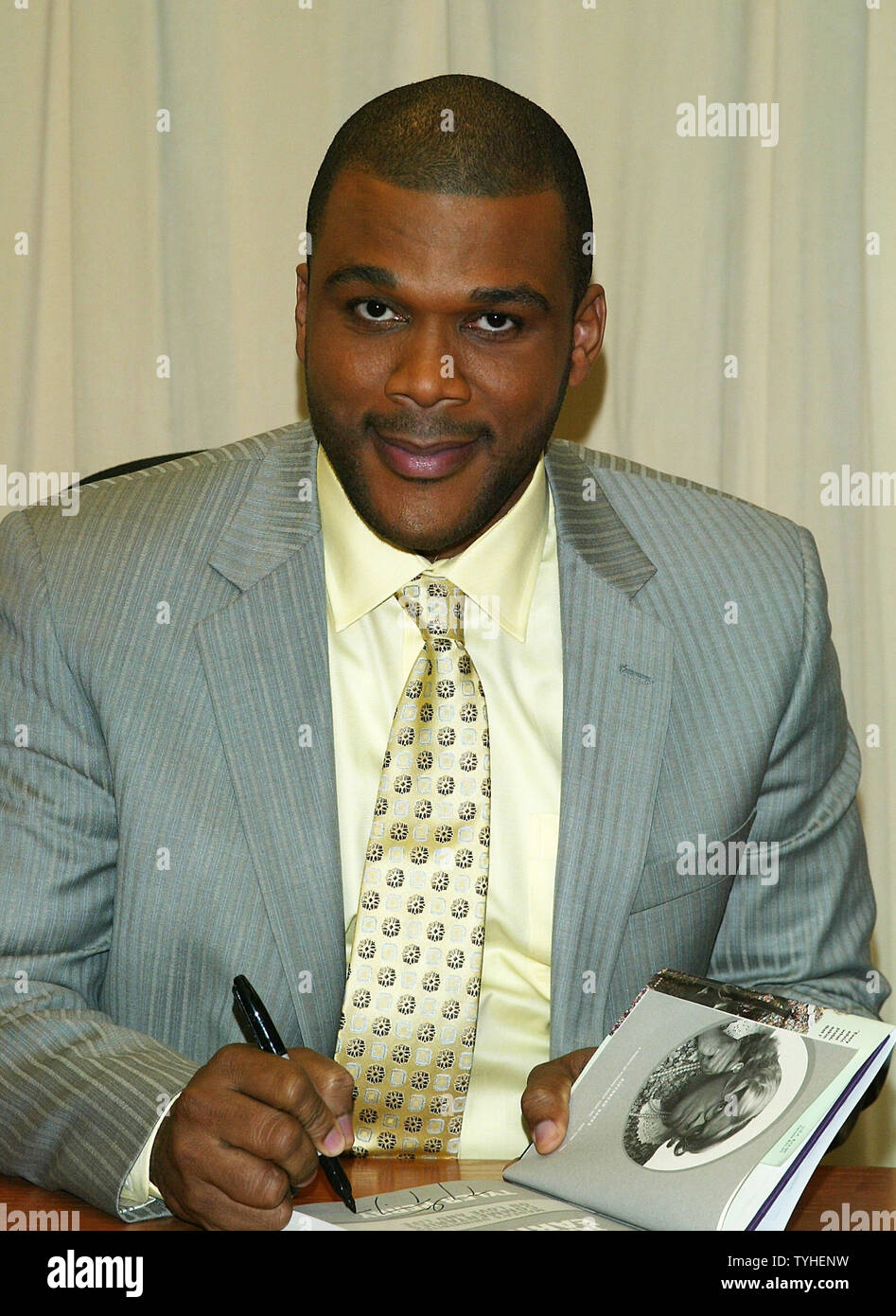 Tyler Perry signs copies of his new book "Don't Make a Black Woman Take ...