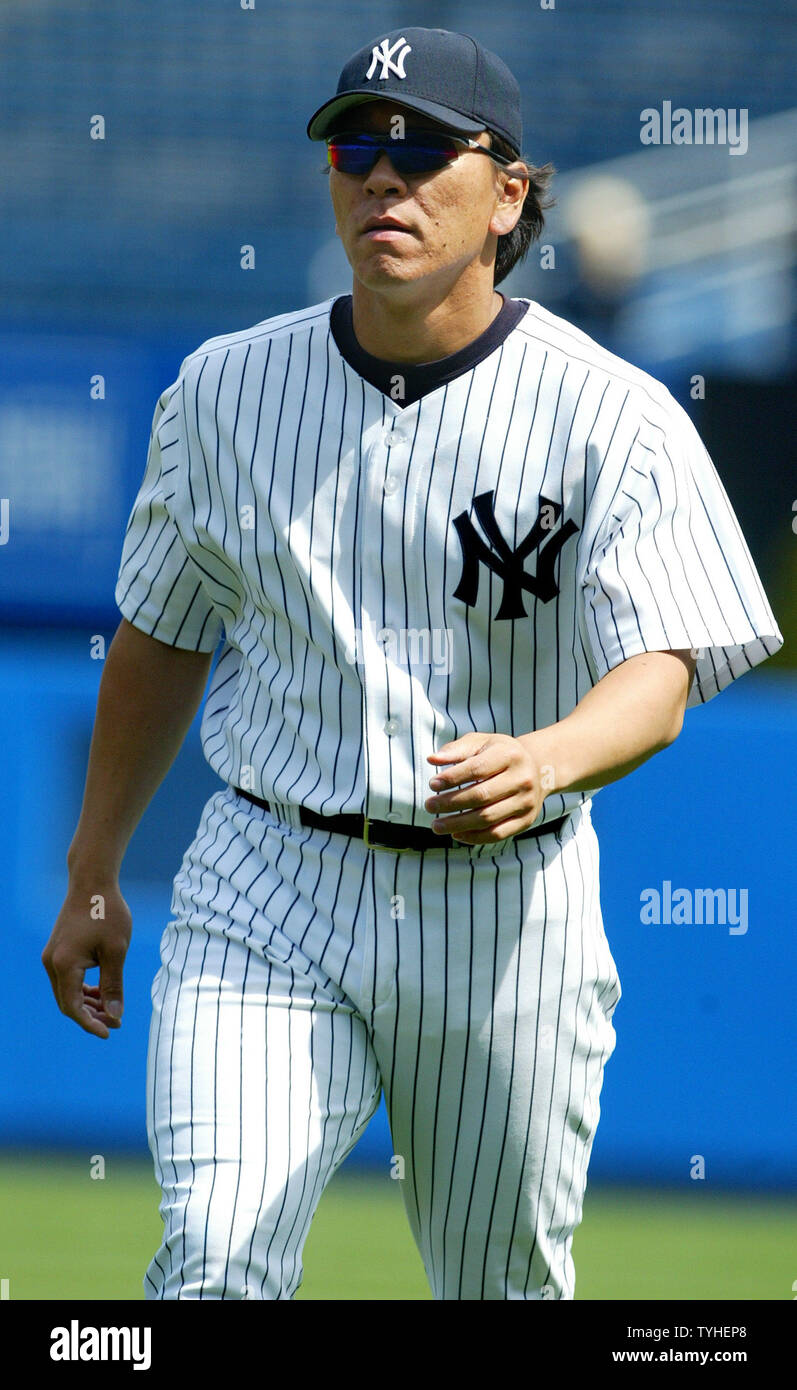 New York Yankees' Hideki Matsui heads back to the dug out after being ...