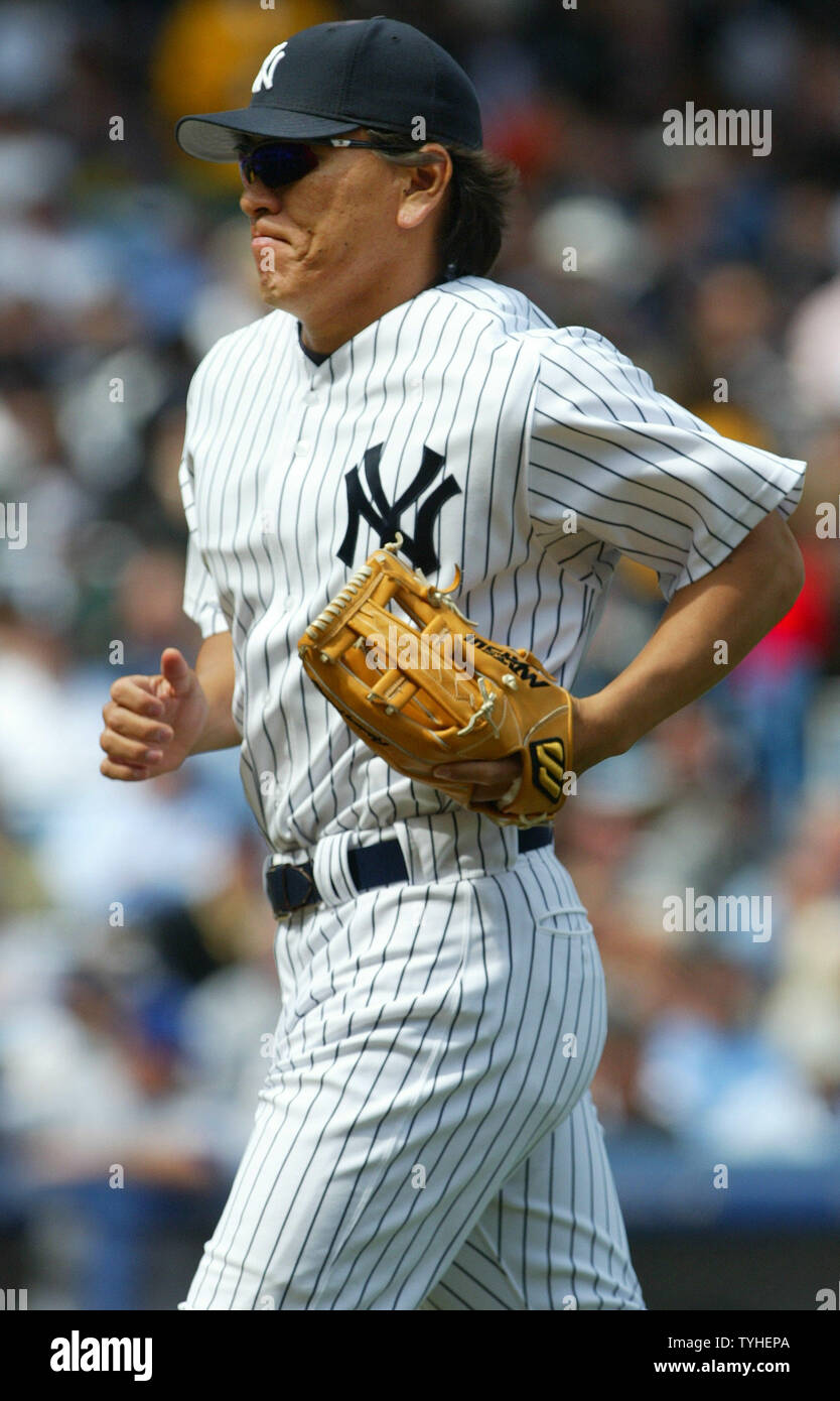 New York Yankees' Hideki Matsui heads back to the dug out in the middle ...