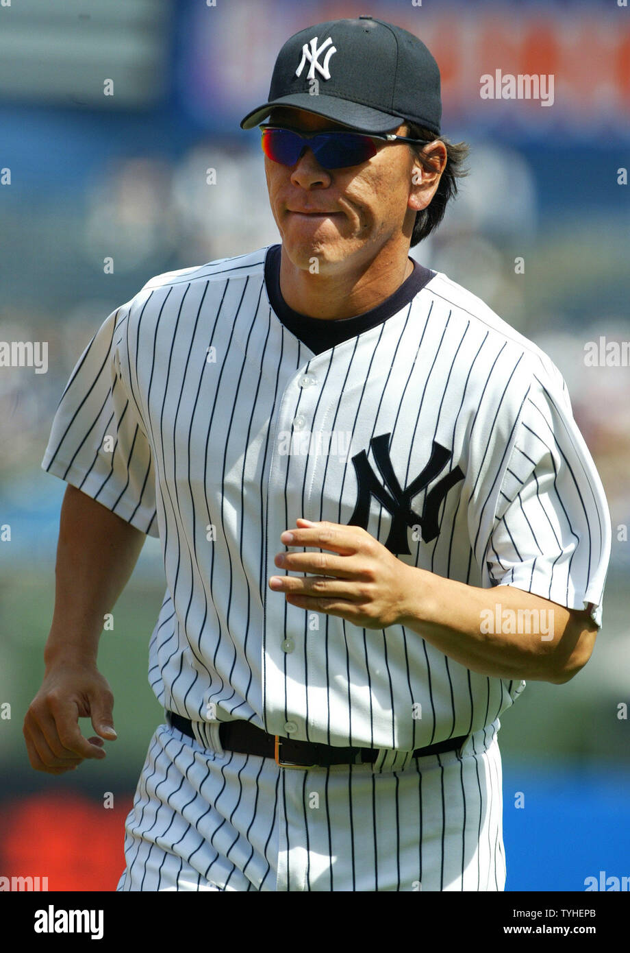 New York Yankees' Hideki Matsui heads back to the dug out after being ...