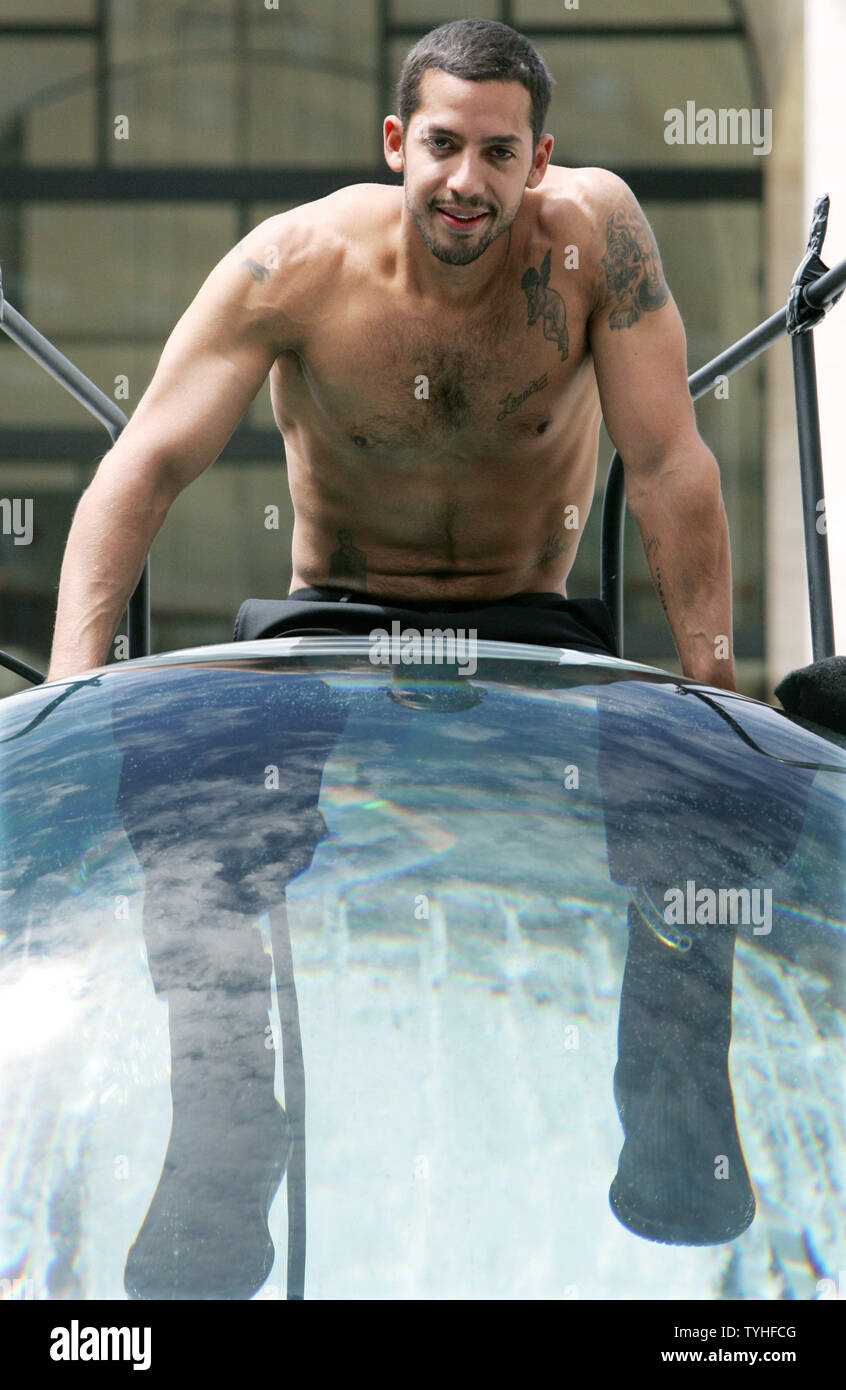 Magician and performance artist David Blaine sits on top of the giant ...