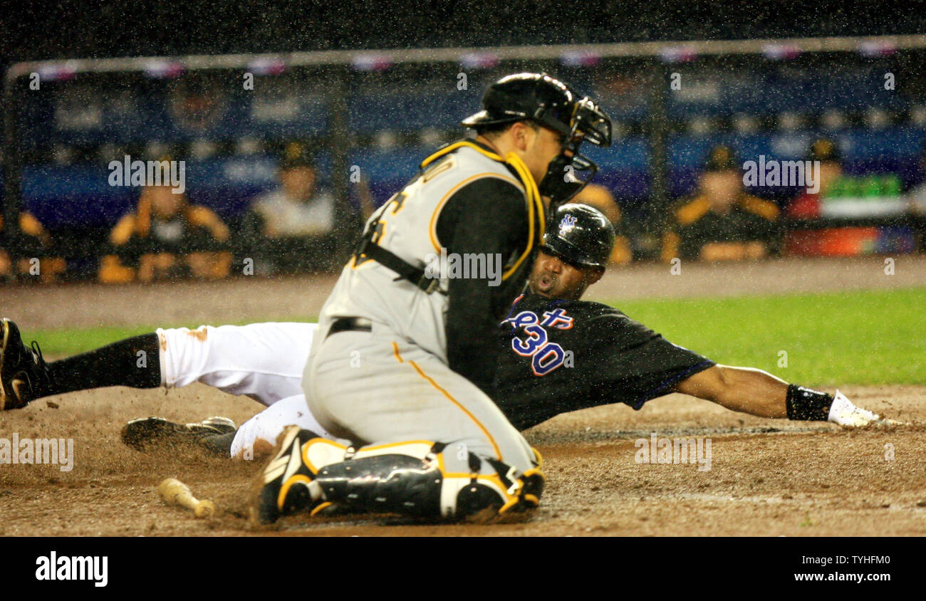 New York Mets (30) Cliff Floyd slides into home during the 6th inning ...