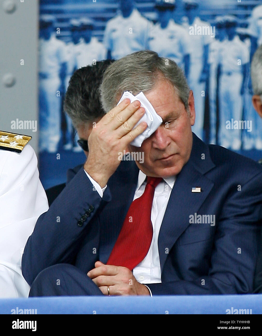 President George W. Bush wipes his forehead after making a speech on ...
