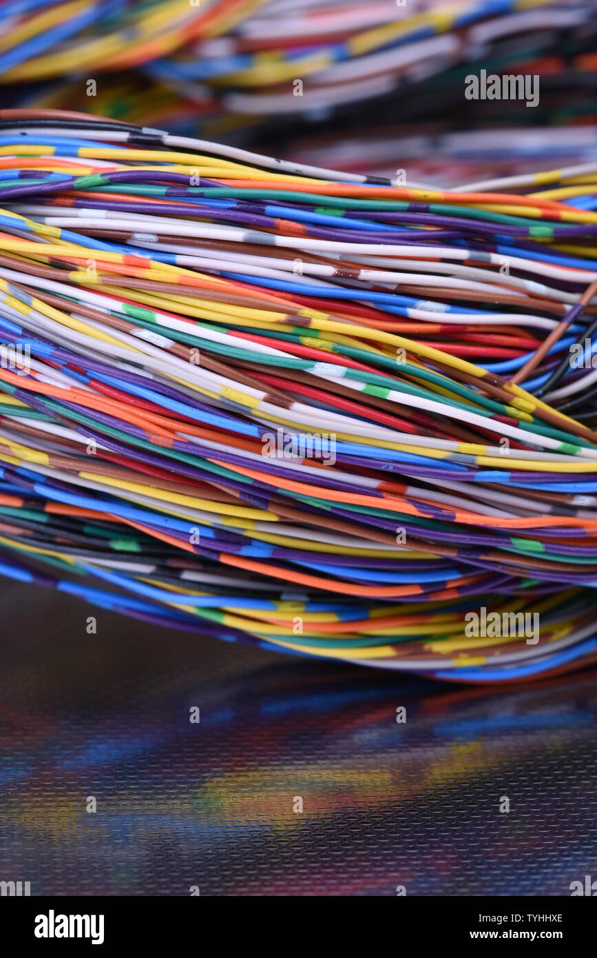 Surface with reflection of colorful electrical wires Stock Photo - Alamy