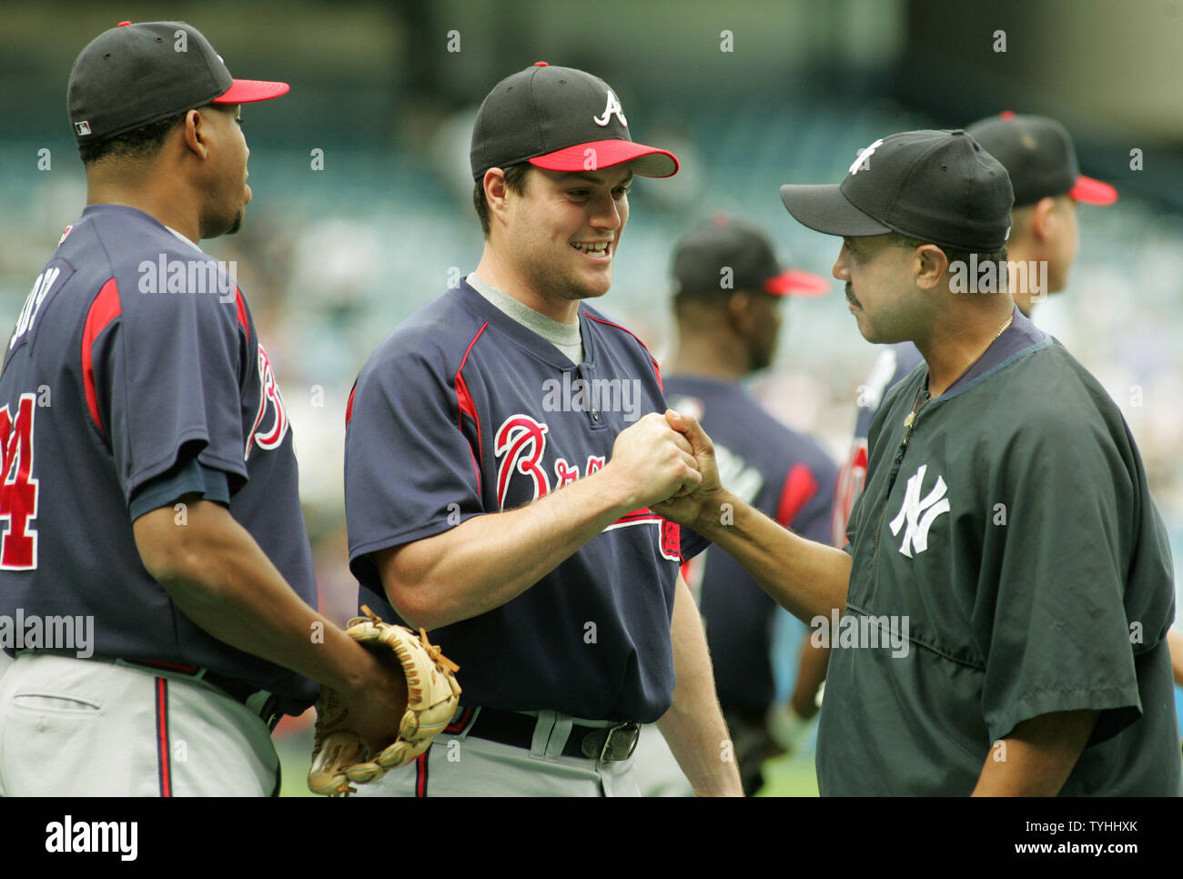 Matt Diaz, center, an outfielder with the Atlanta Braves, greets Tony ...
