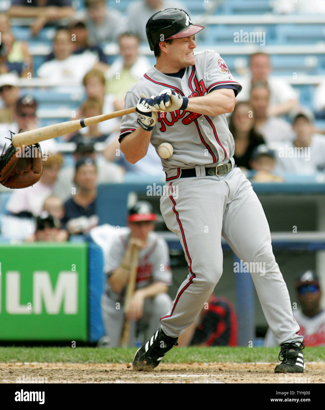 Matt Diaz of the Atlanta Braves is hit by a pitch in the eleventh ...