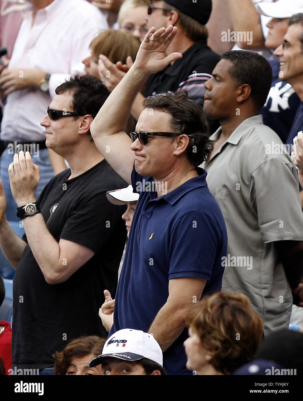 Tom Hanks acts like a music conductor while the Yankee fans sing take ...