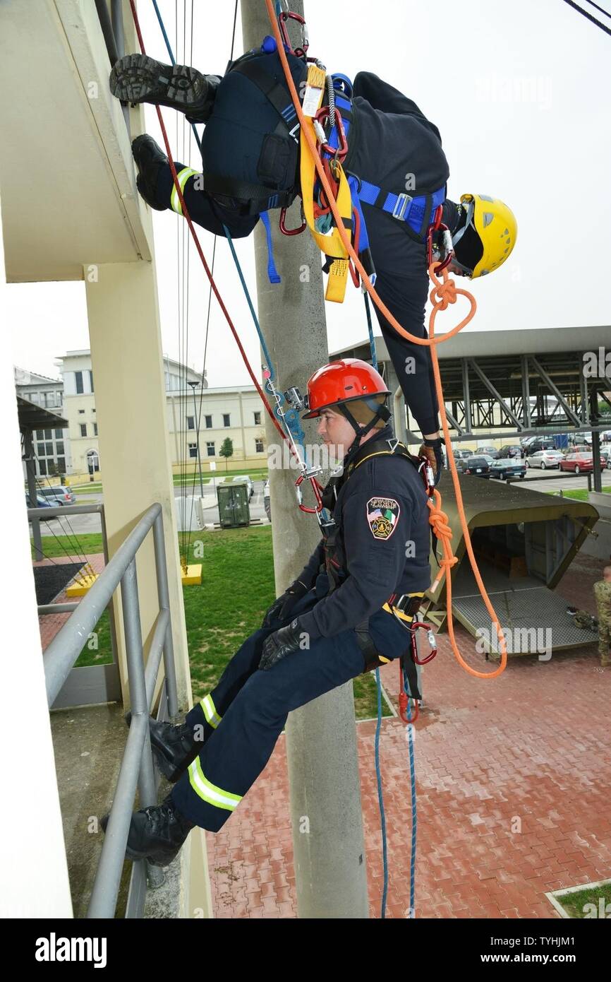Firefighters Michele Santagiuliana and Damon Favor assigned to U.S ...