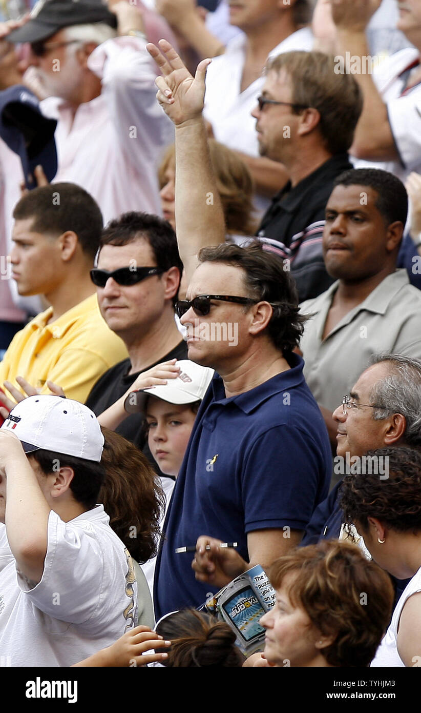 Tom Hanks acts like a music conductor while the Yankee fans sing take ...