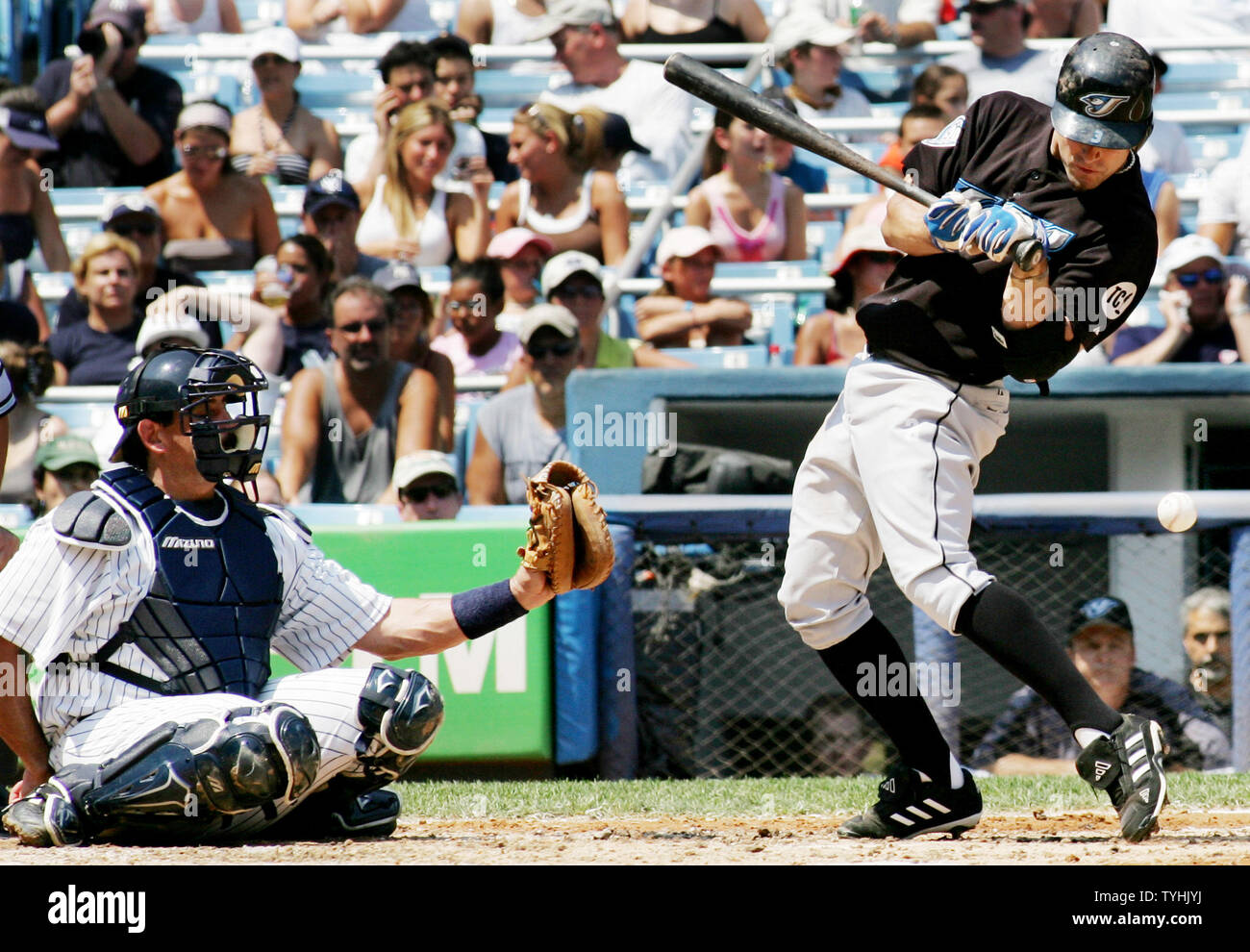 Toronto Blue Jay Reed Johnson, right, is hit by New York Yankee Cory ...