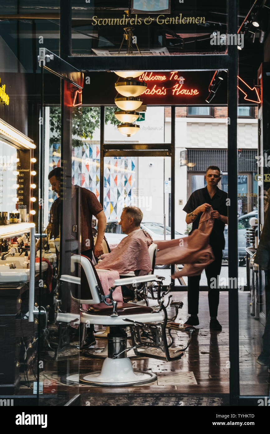 Inside interior man getting haircut hi-res stock photography and images ...