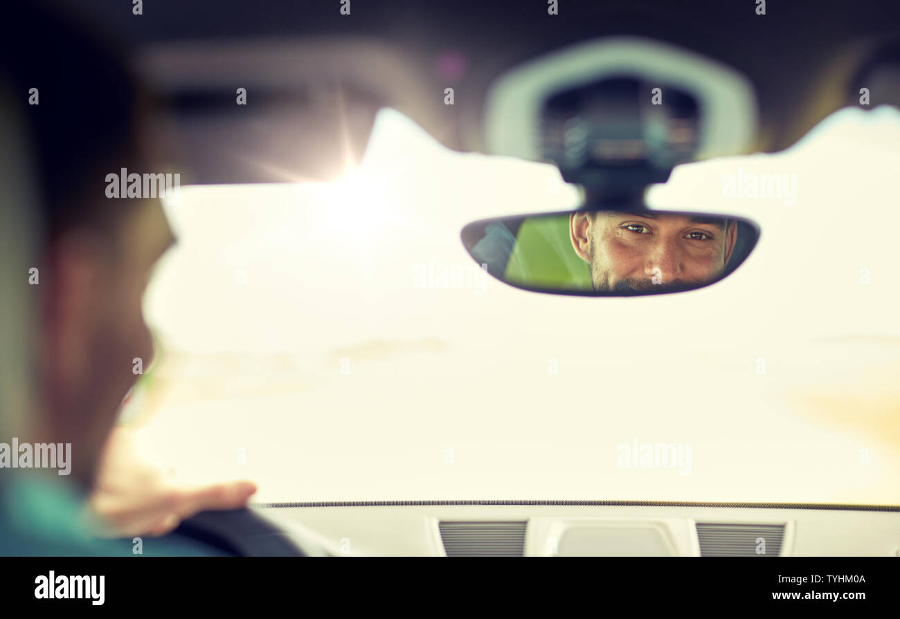 rearview mirror reflection of man driving car Stock Photo - Alamy