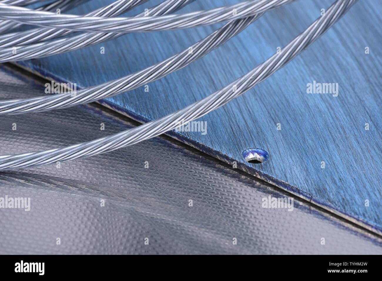 Aluminum sheet and steel cable Stock Photo - Alamy